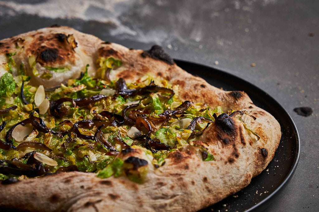 German Brussels Sprouts Pizza with Blue Cheese, Onions and Almonds ...
